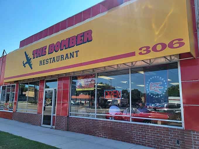 The Bomber's bold yellow and red exterior announces its presence like a delicious landing strip for hungry travelers.