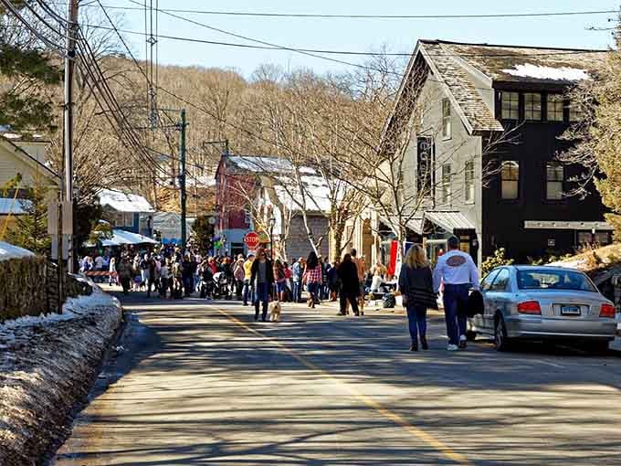 Crowds gather on winter streets where community spirit warms you better than any coat ever could, pure small-town joy.