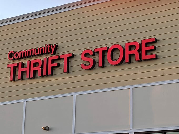 Those bold red letters against tan siding announce a community hub where neighbors help neighbors through the power of thrifting.