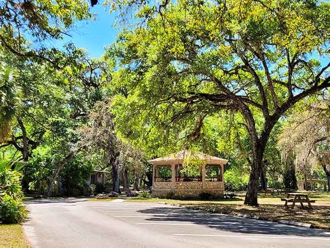 A shaded pavilion nestled among live oaks offers the perfect spot for contemplating history and enjoying gentle breezes.