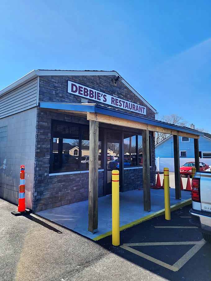 The cheerful blue trim and bright signage make this compact spot impossible to miss, even on the busiest day.