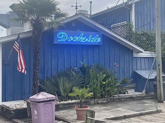 The bright blue building looks like it sailed straight off a postcard and landed here to serve you.