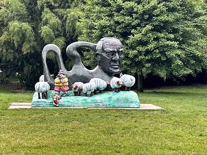 At Grounds For Sculpture, this surreal green figure seems to emerge from the earth itself, blending art with landscape.