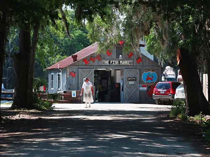 Rustic fish market tucked under ancient oaks where fresh catch meets Old Florida charm in the best way.