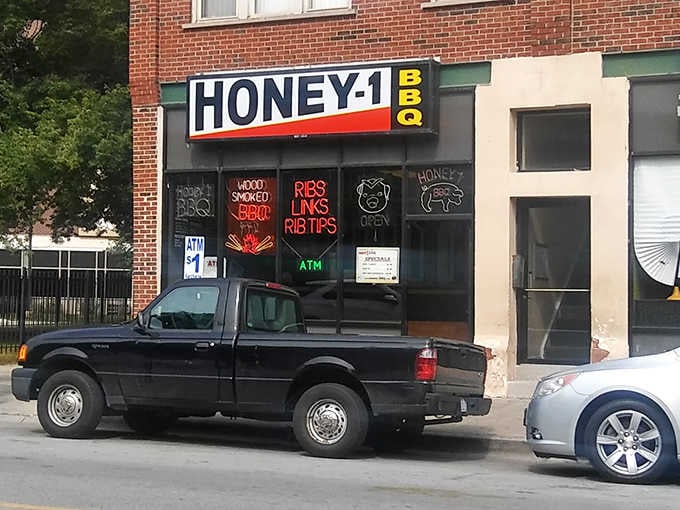 Honey 1's no-nonsense storefront with glowing neon signs hints at the serious BBQ business happening inside.