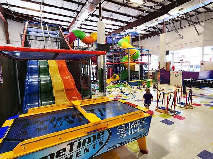 Rainbow slides cascade down like a waterfall of pure joy, connecting different levels of this colorful paradise.