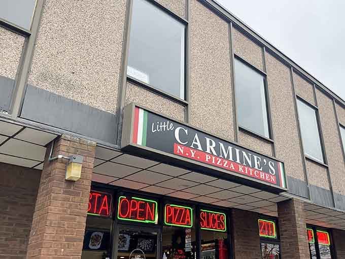 Little Carmine's straightforward storefront announces its NY pizza heritage with pride. Those neon signs speak the universal language of "get in here!"