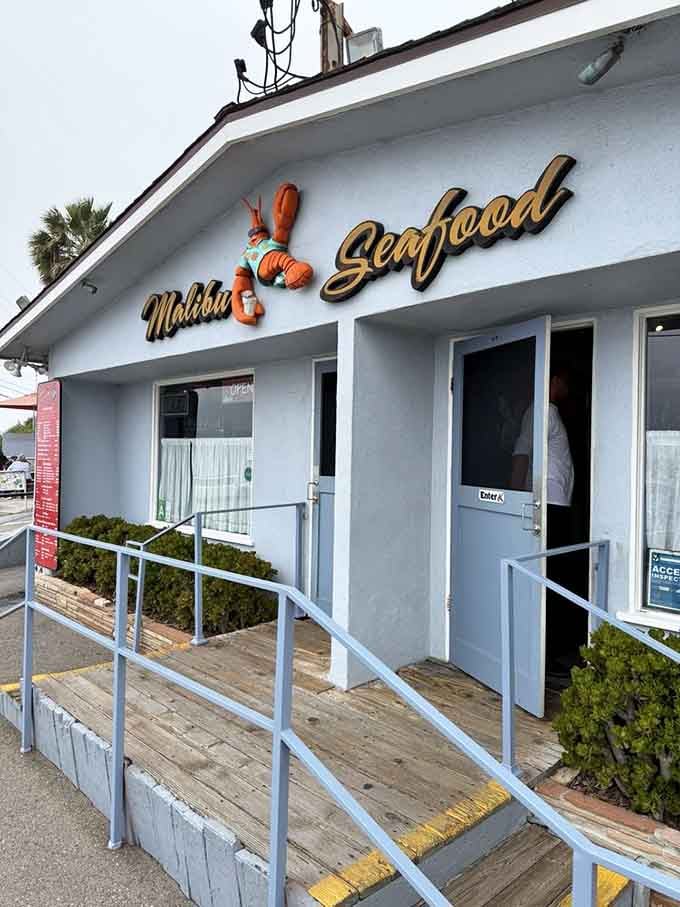 Malibu Seafood's cheerful lobster sign is like a friendly wave saying, "Yes, this is the place your taste buds have been dreaming about!"