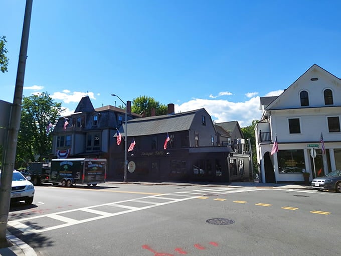 Where Main Street still means something—vintage architecture meets timeless American pride under blue skies.