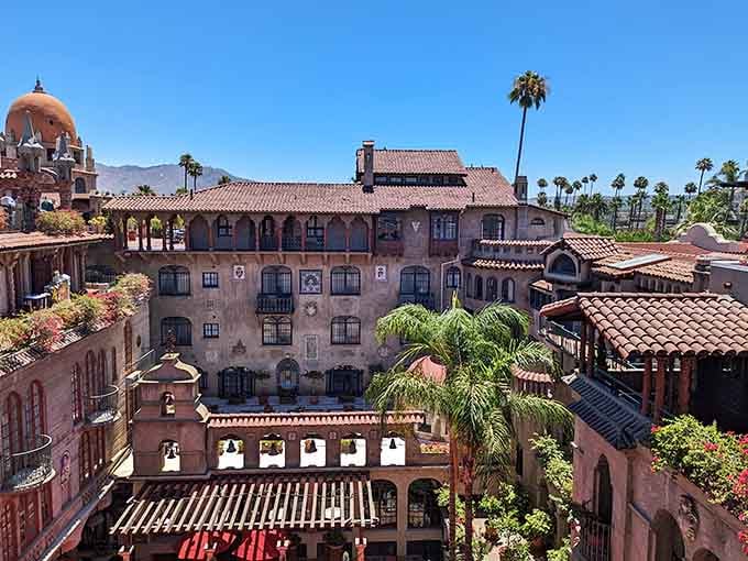 Spanish arches and ornate courtyards sprawl across an entire city block like a small village frozen in romantic time.