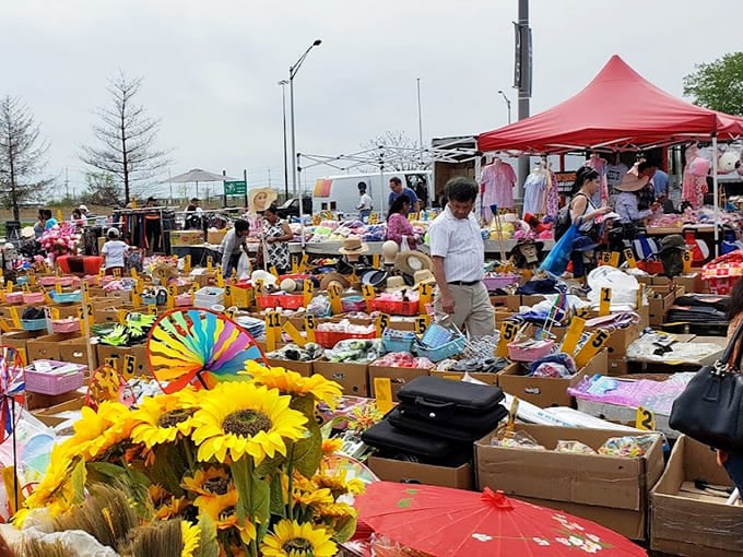Bright sunflowers add natural beauty to tables overflowing with practical treasures, making shopping feel like a garden party.