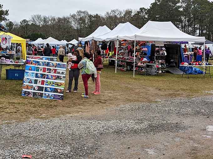 White tents line up like a festival of possibilities, where every booth holds potential treasures under the open sky.