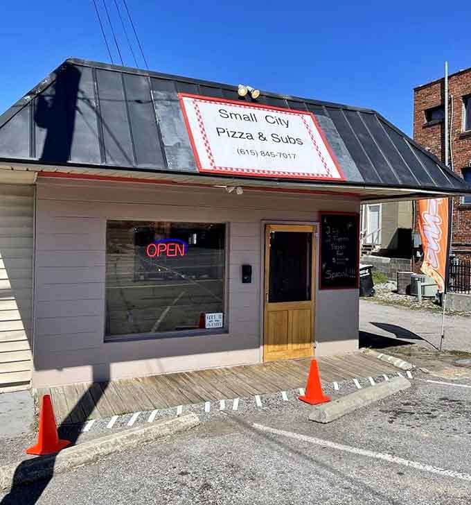 Small City Pizza's unassuming exterior hides pizza treasures that would make even New York jealous. That neon "OPEN" sign beckons like a lighthouse for hungry travelers.