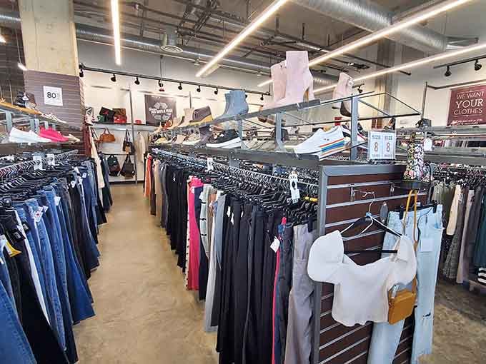 Clothing racks curve through the space like a colorful maze, with every turn revealing another potential wardrobe winner.