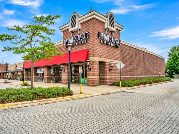 Red awnings and classic brick construction create an inviting storefront that's impossible to drive past without stopping.