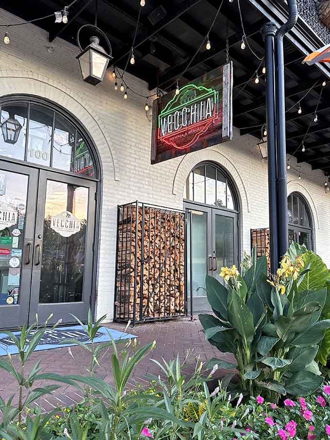 Vecchia's glowing sign hangs beneath twinkling lights, creating an atmosphere that's pure Italian magic in suburban Hoover.