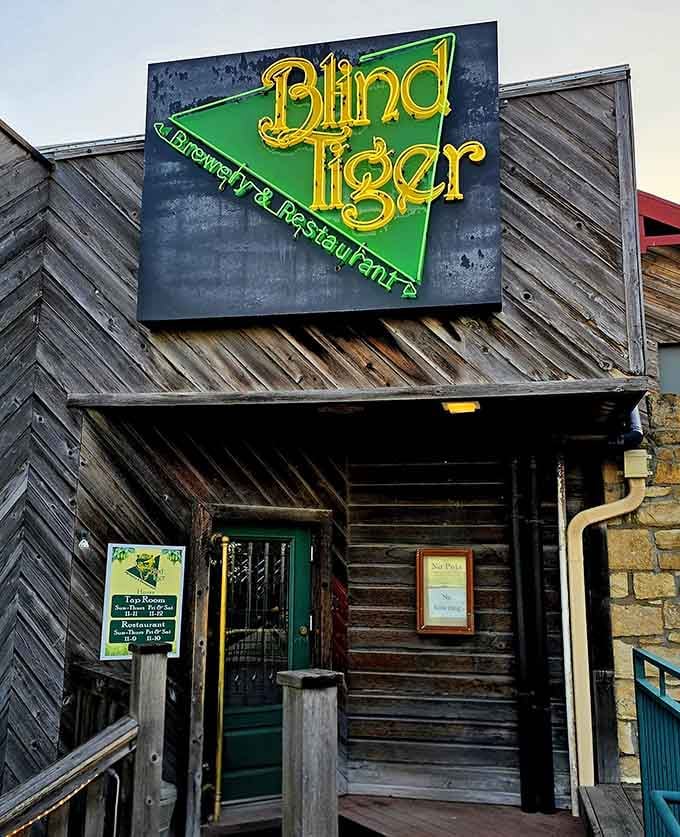 Weathered wood and a glowing green sign &ndash; Blind Tiger's exterior hints at the craft beer magic brewing inside.