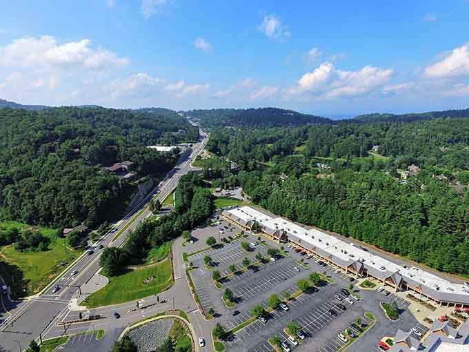 The view from above reveals Blowing Rock's perfect mountain setting, where forest meets civilization in a harmonious Blue Ridge embrace.