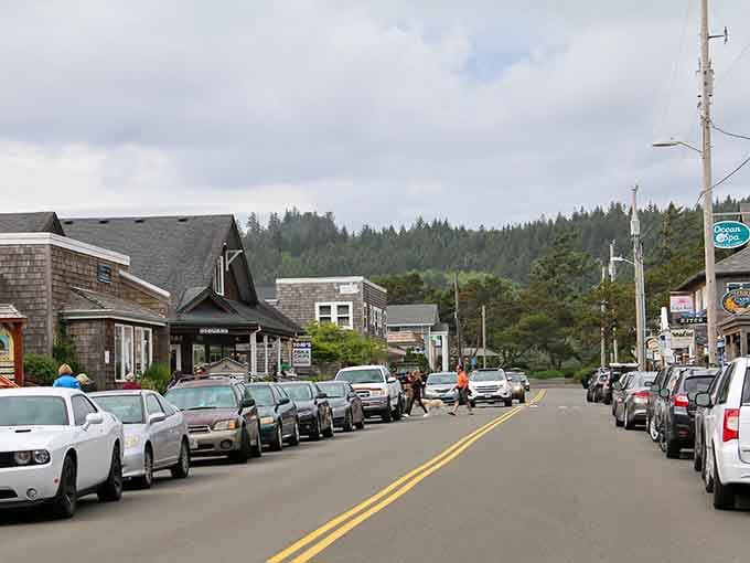 Coastal pines frame the street while weathered buildings whisper tales of storms weathered and sunsets celebrated together.