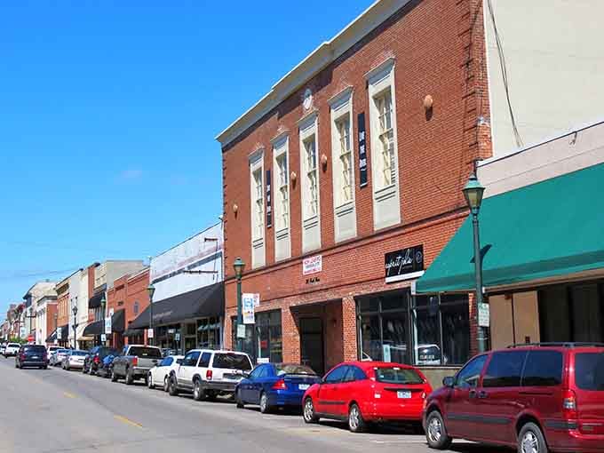 Tall windows and ornate brickwork crown this downtown block where parking spots fill up faster than Sunday church pews.