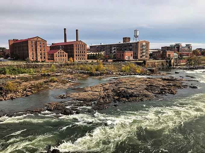 Columbus' industrial heritage meets raw natural beauty where churning rapids flow past historic brick mill buildings&mdash;a testament to Georgia's gritty, transformative river city spirit.