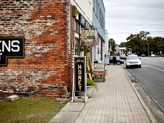 Brick meets history on Darien's main street. The weathered walls and "Local Honey" sign perfectly capture this coastal town's sweet, unhurried charm.