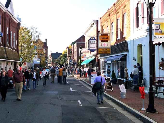 Festival crowds fill the street with energy, transforming everyday sidewalks into a celebration of community and connection together.