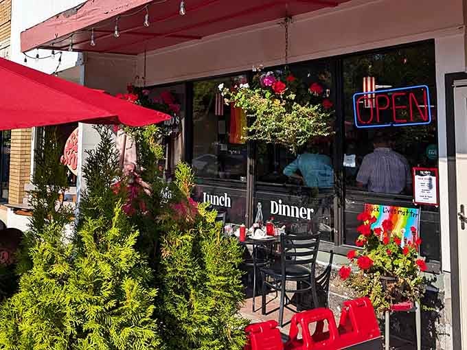 The lush greenery and vibrant outdoor seating turn a simple meal into a delightful al fresco experience.