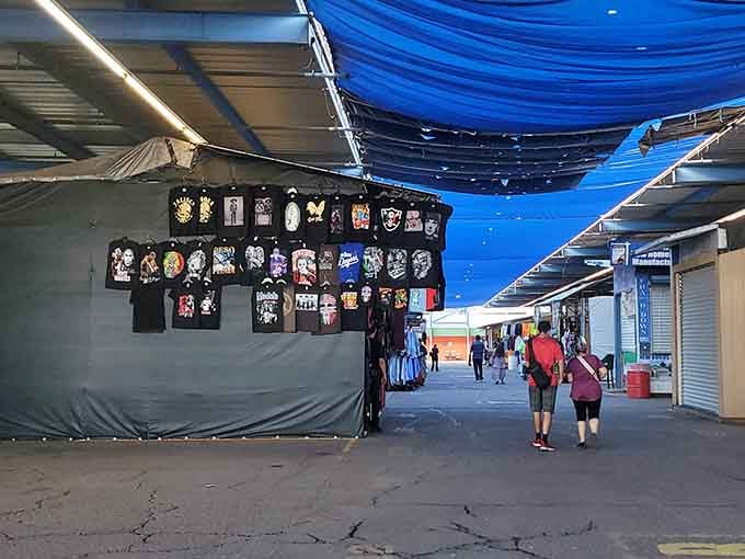 Blue shade tarps create dramatic lighting effects that make even casual browsing feel like an artistic adventure.