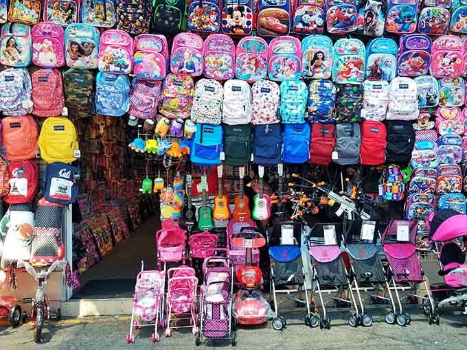This backpack wall looks like a rainbow exploded in the best possible way&mdash;every color imaginable for every kid.