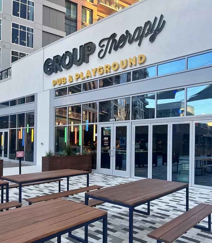 This contemporary pub facade with playful signage invites grown-ups to rediscover the simple joy of playground competition.