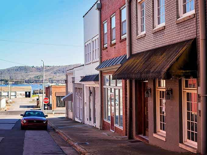 Morning light catches brick facades that have weathered storms and celebrated sunny days for more generations than most remember.