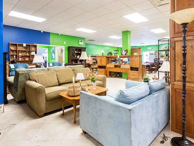 Bright blue and green walls create a cheerful showroom where furniture displays rival any retail furniture store.