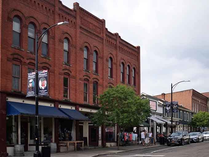 Red brick buildings stand shoulder to shoulder, their windows reflecting decades of small-town stories and Sunday dinners.