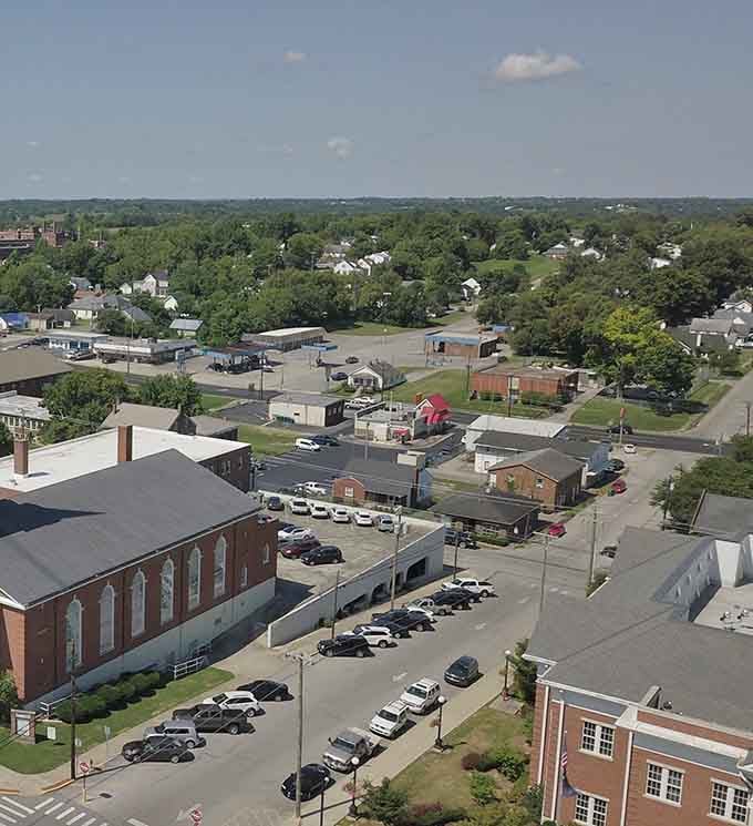 From this bird's-eye view, the town spreads out like a quilt of rooftops, parking lots, and tree-lined streets.