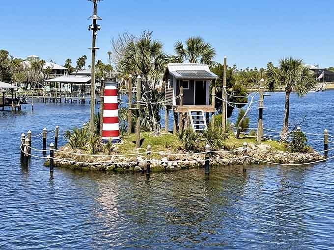 That tiny lighthouse on its own island is pure whimsy, like someone's backyard project became a beloved landmark.