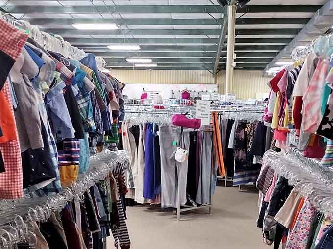 Colorful garments hang in neat rows under industrial lighting, making treasure hunting feel almost scientific.