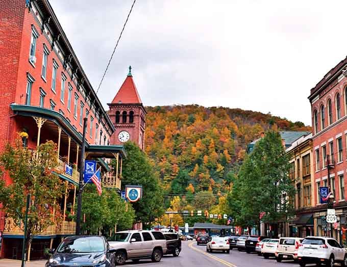 Autumn's paintbrush transforms the mountainside into a masterpiece while the clock tower keeps faithful time below.
