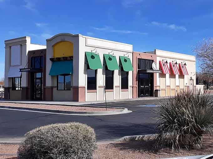 Colorful awnings and desert landscaping create a cheerful streetscape that says "welcome" louder than any billboard could.