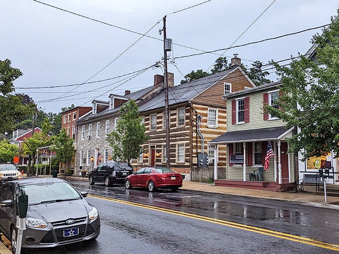 Rain-slicked streets reflect the warm glow of historic buildings, creating a moody beauty that photographers absolutely adore.
