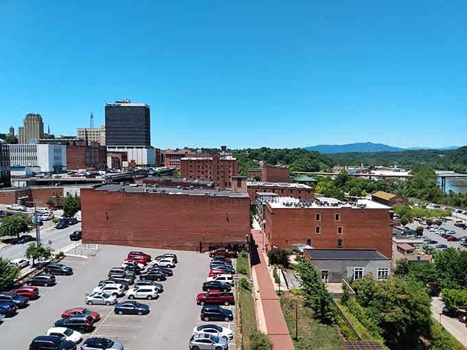 Mountains frame the cityscape while brick buildings stand testament to affordability meeting genuine Southern charm perfectly.