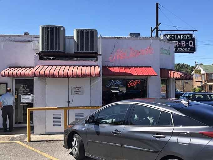 That classic red awning at McClard's has sheltered more BBQ dreams than we can count.