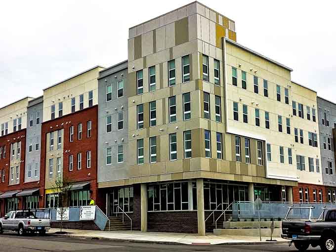 Modern apartments bring fresh energy to historic streets, proving that progress and preservation can actually coexist quite beautifully together.