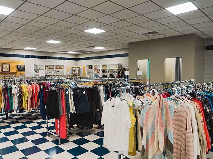 Rows of colorful clothing stretch endlessly inside, creating a rainbow of possibilities on that classic checkered floor.
