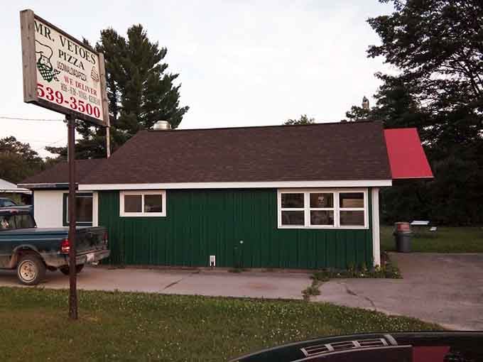 This humble green building houses northern Michigan's beloved pizza institution – proof that great things come in simple packages.