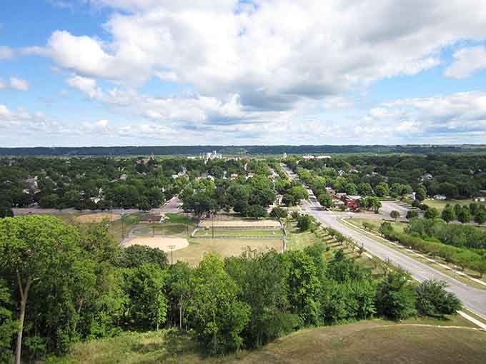 From this hilltop view, the town spreads out below like a quilt of green trees and rooftops.