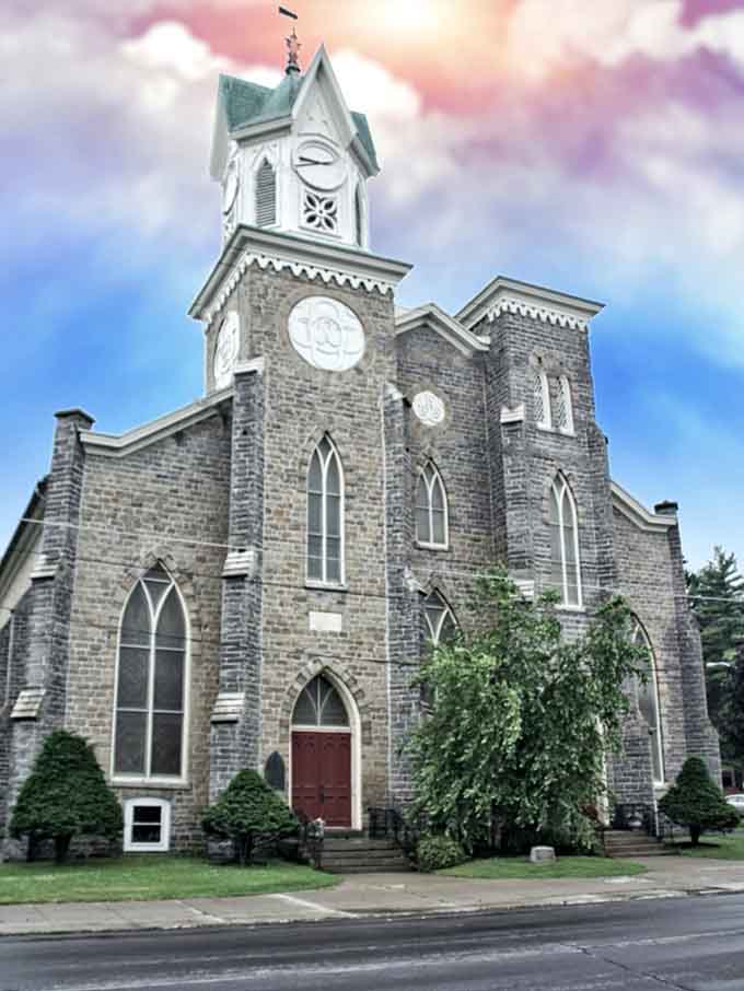 This Gothic Revival church tower reaches skyward with elegant stonework that would make any European village jealous, truly.