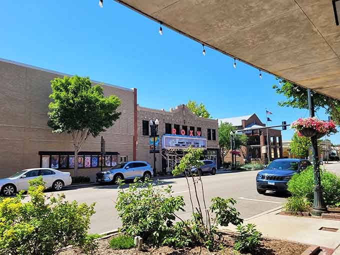 The ornate streetlights stand like sentries along the sidewalk, lighting the way for evening strolls and window shopping.
