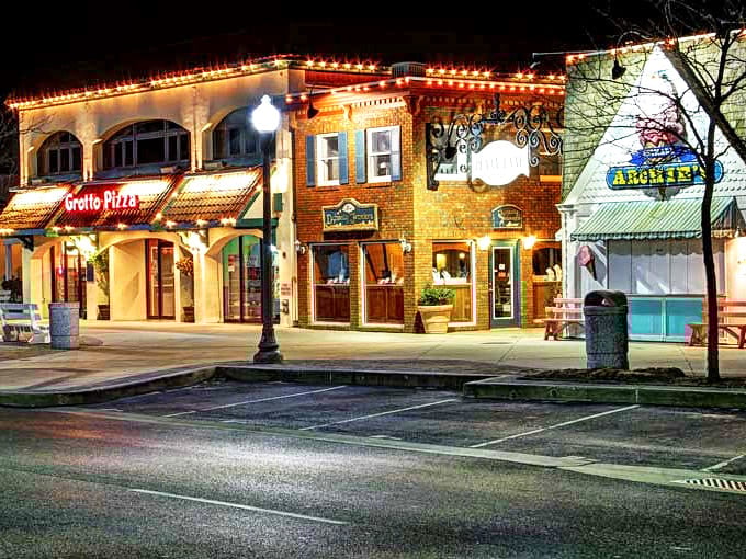 Night falls on Rehoboth's main street, transforming everyday shops into glowing beacons of small-town magic.