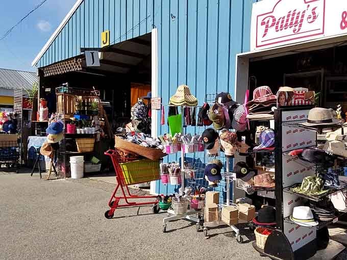 Vintage shopping carts and straw hats stacked high create an outdoor bazaar atmosphere that feels wonderfully nostalgic and authentic.